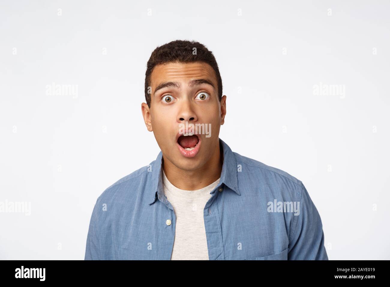 Omg no way. Impressed, shocked handsome questioned guy in blue shirt ...