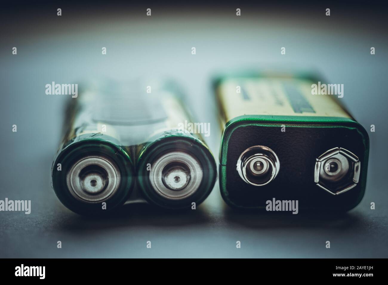 Two different types of batteries on the dark table close-up Stock Photo ...