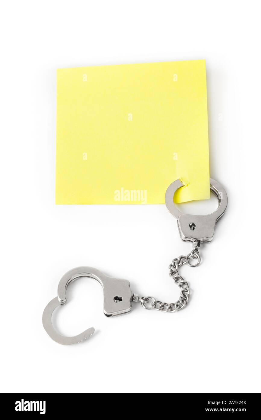 Blank paper with handcuffs Stock Photo - Alamy
