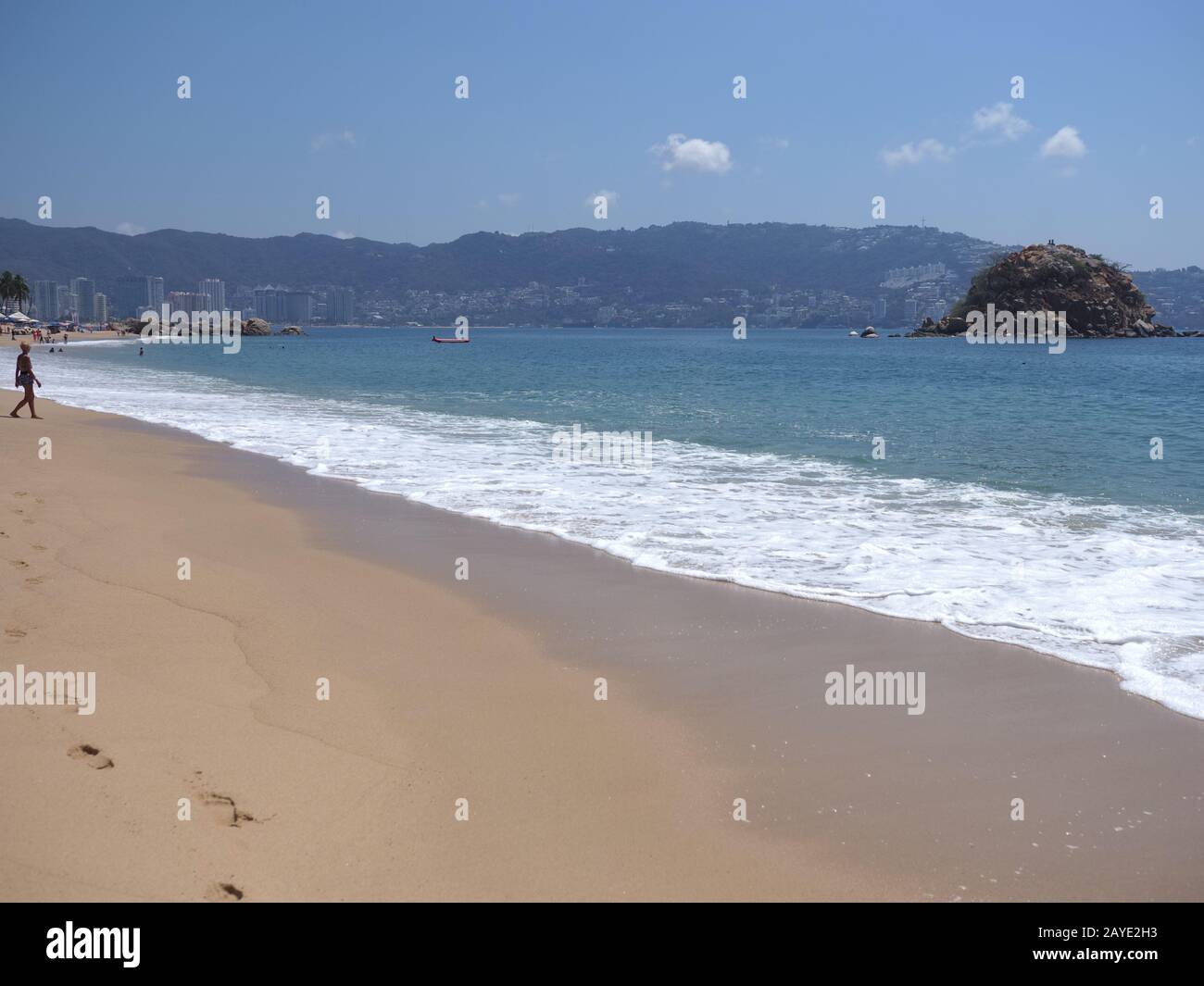 Beach with white waves and rock at ACAPULCO city in Mexico Stock Photo ...