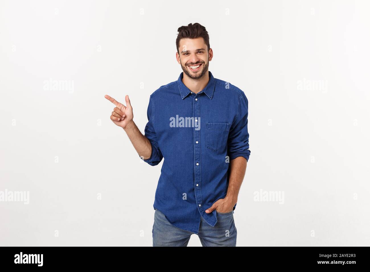 Man pointing showing copy space isolated on white background. Casual ...