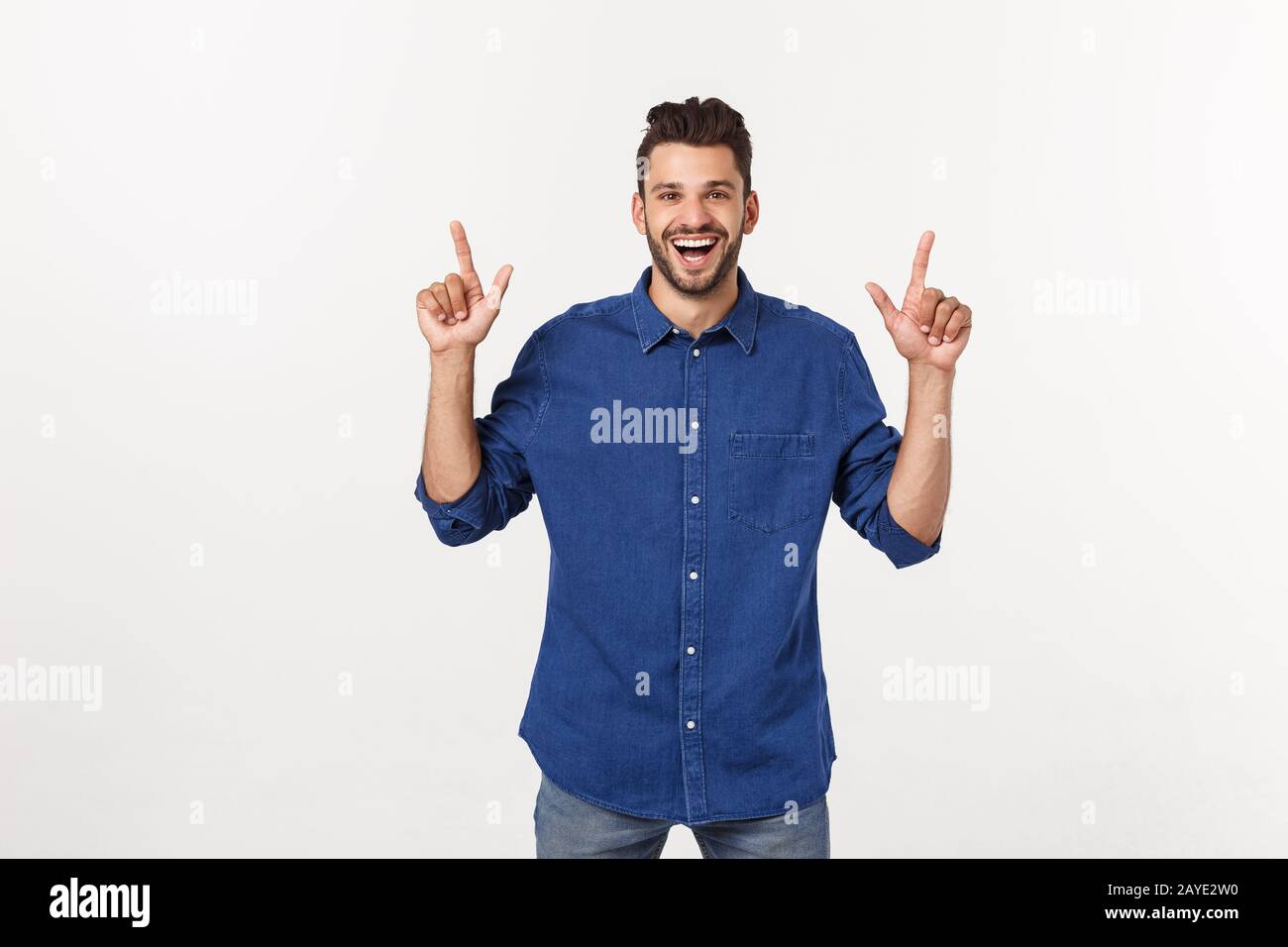 Man pointing showing copy space isolated on white background. Casual ...