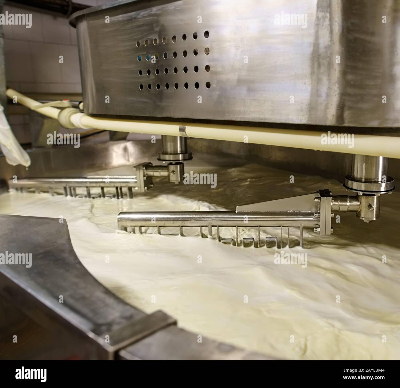 Process of mixing at dairy production line Stock Photo - Alamy