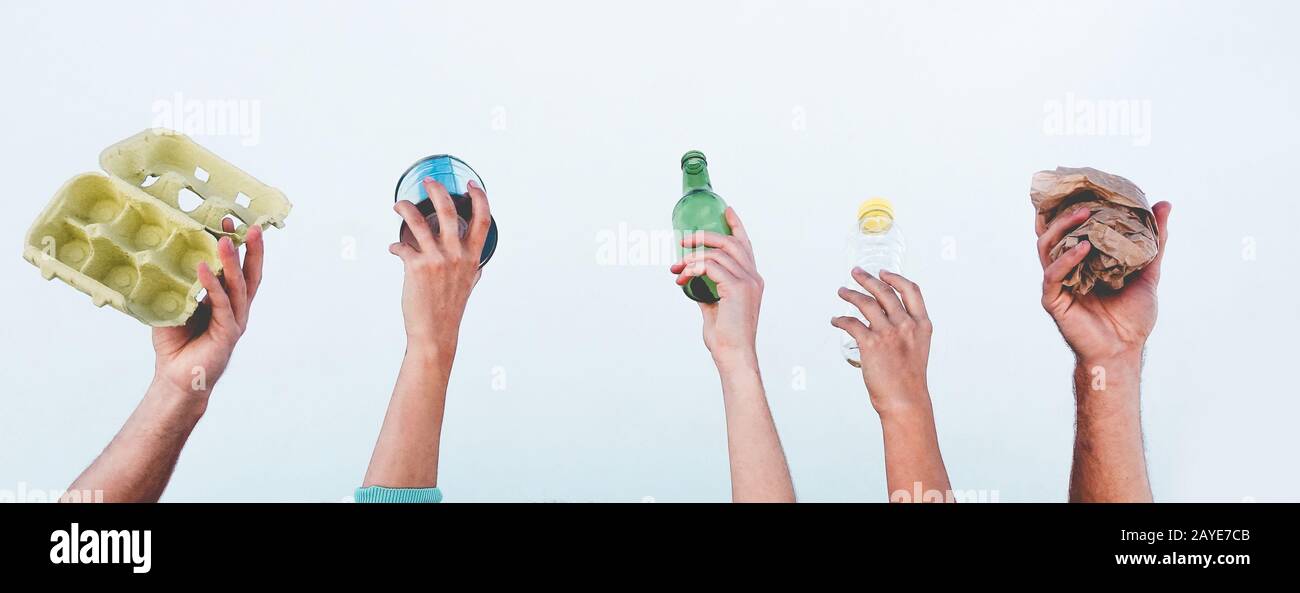 Human hands showing recyclable paper, plastic, glass and aluminum can ...