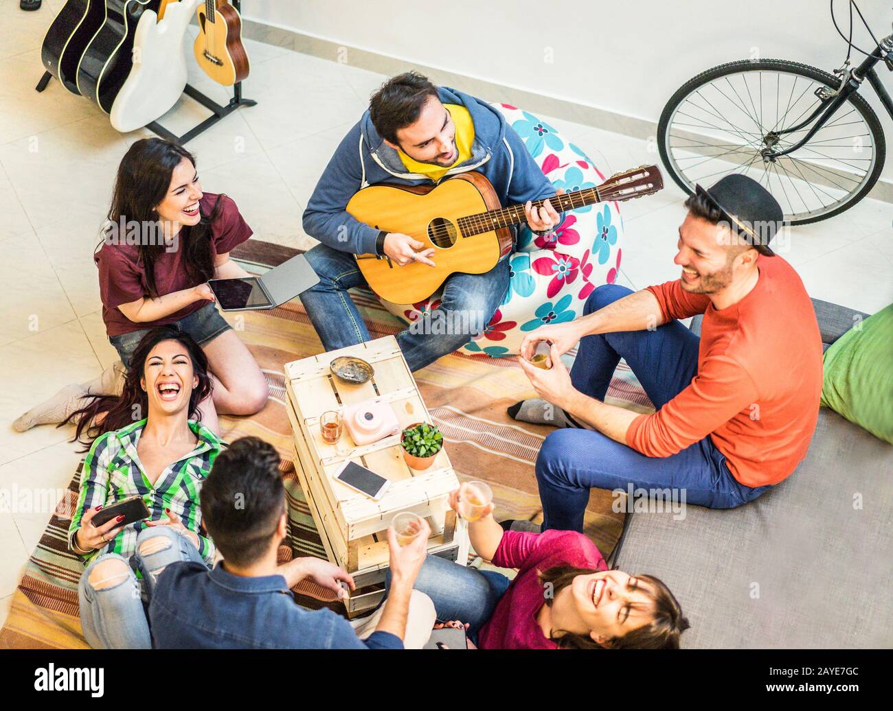Trendy friends having fun in home living room - Happy young people ...