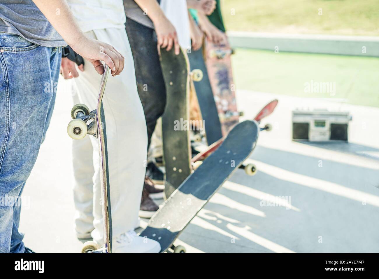 Group of skaters friends in urban contest with skateboards in their ...