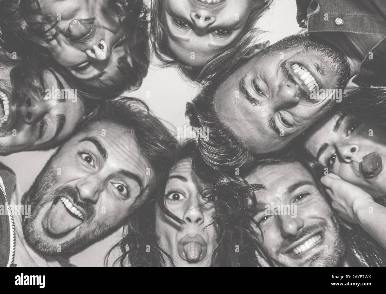 Bottom view of young friends making funny faces on camera - Happy ...