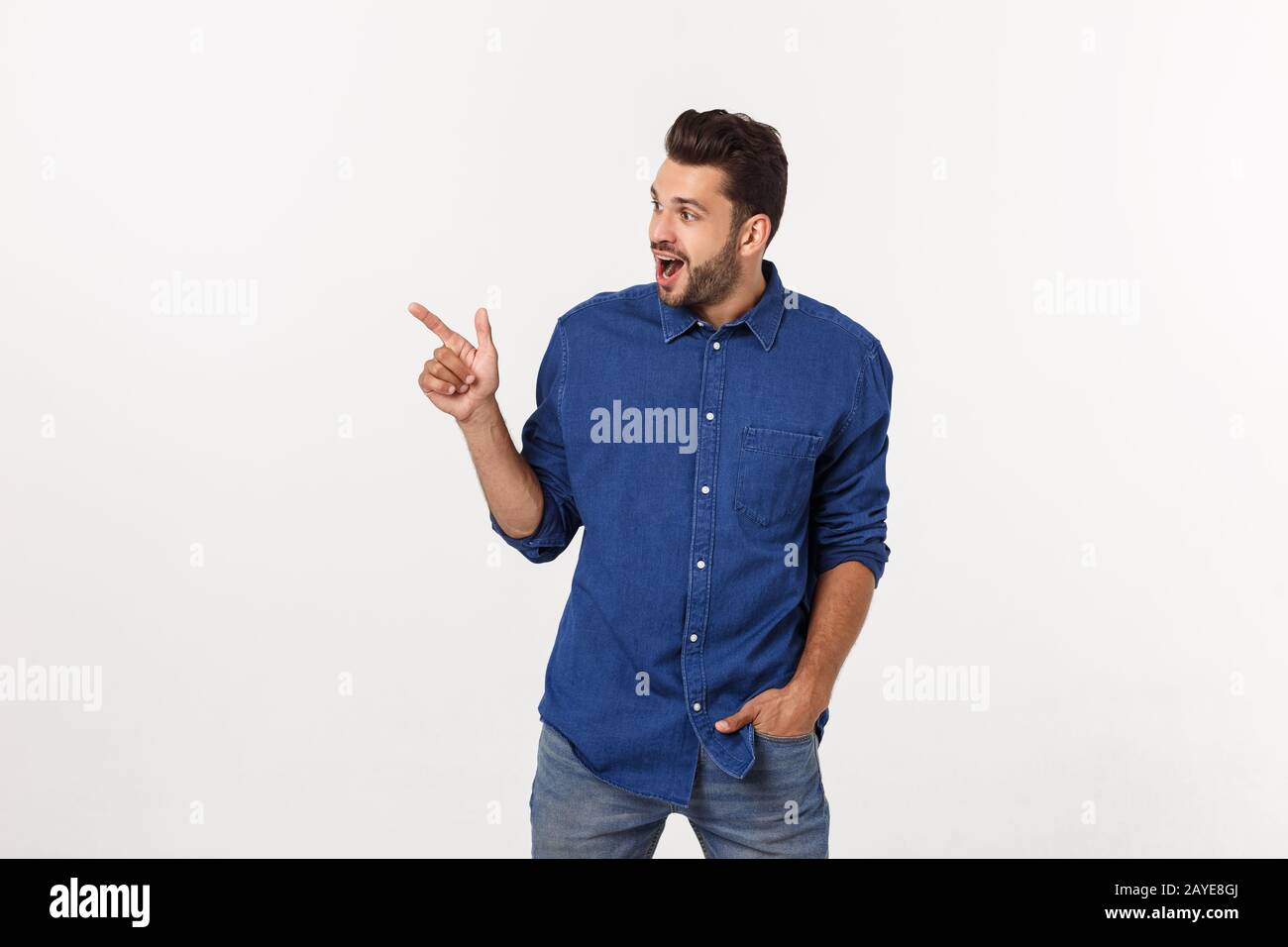 Man pointing showing copy space isolated on white background. Casual ...