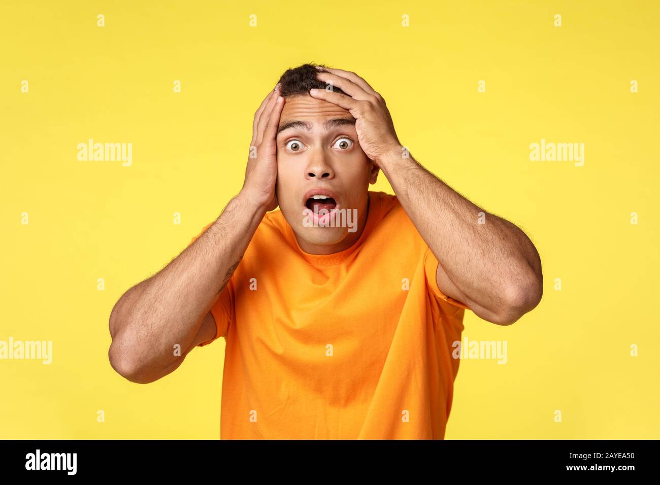 Shocked speechless young man heard something astonishing and terrible ...