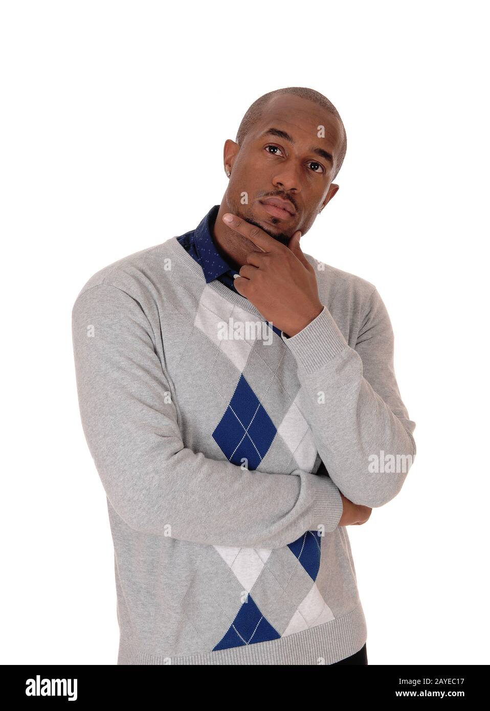 African man with his hand on his neck, thinking Stock Photo - Alamy
