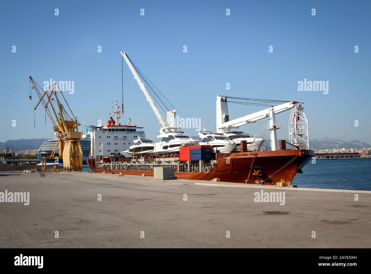 A big transport ship is loaded with some yachts Stock Photo - Alamy