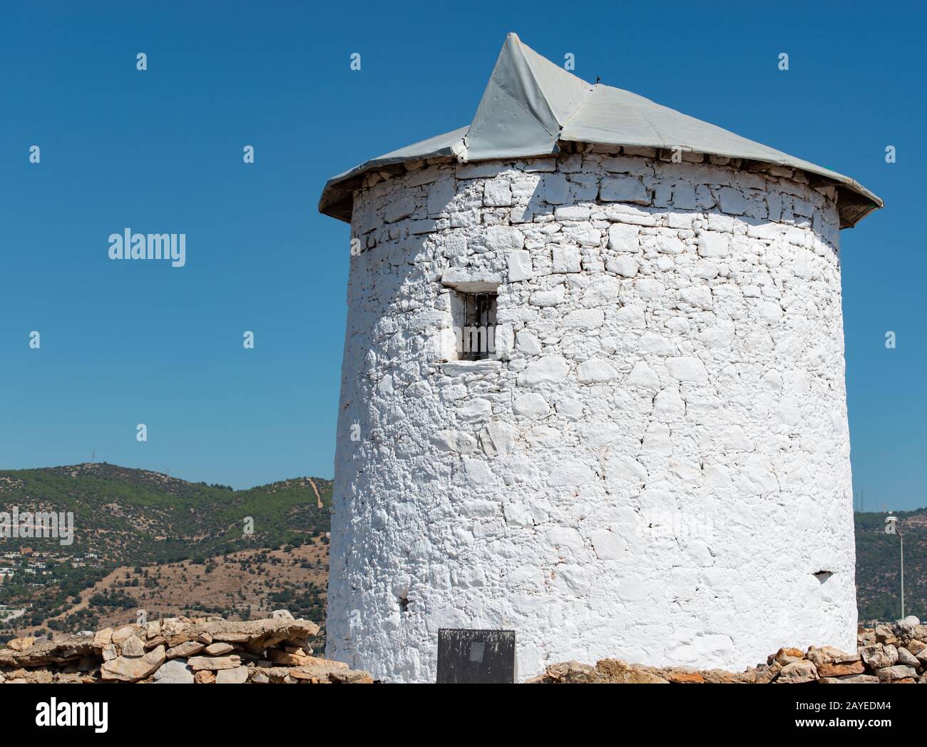 Architecture Details of View of an old Greek mill and palm trees on the ...