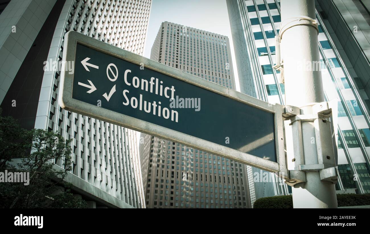 Street Sign Solution versus Conflict Stock Photo - Alamy