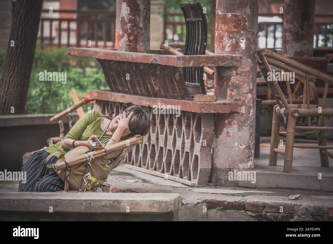 Woman sleeping in chairs hi-res stock photography and images - Alamy