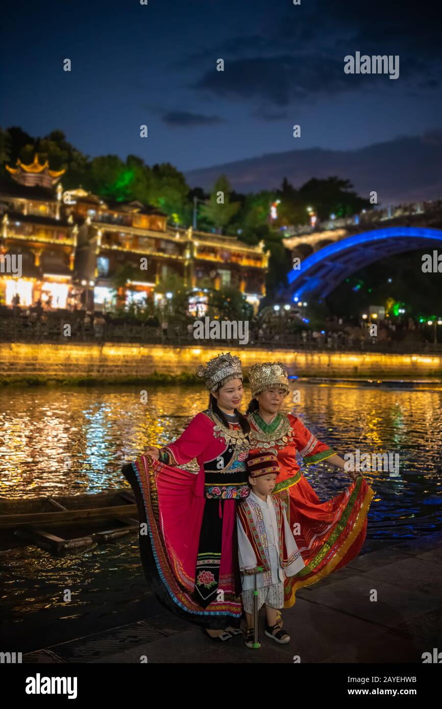 Posing for a photo in Feng huang Stock Photo - Alamy