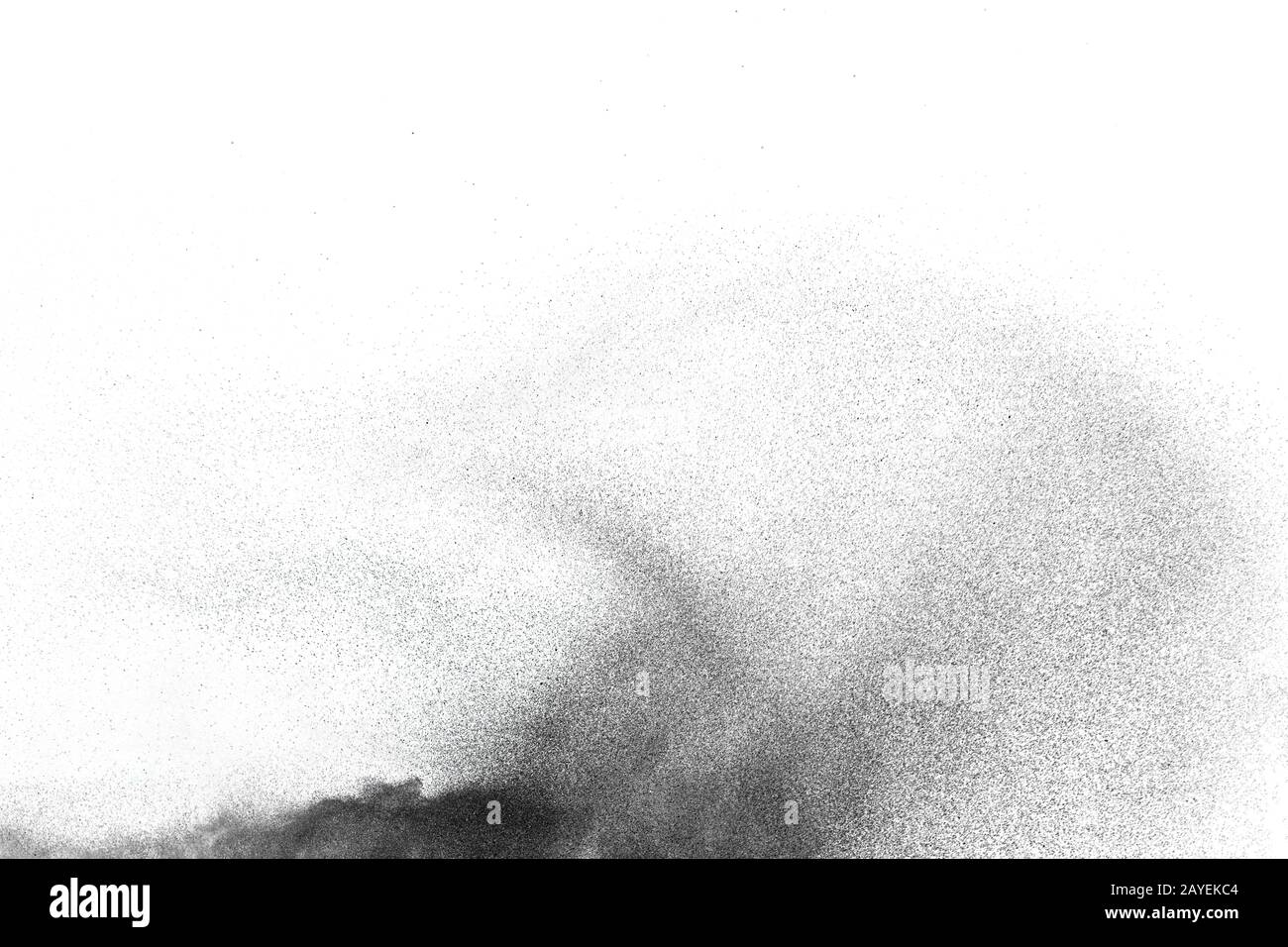 Black powder explosion against white background.Charcoal dust particles ...