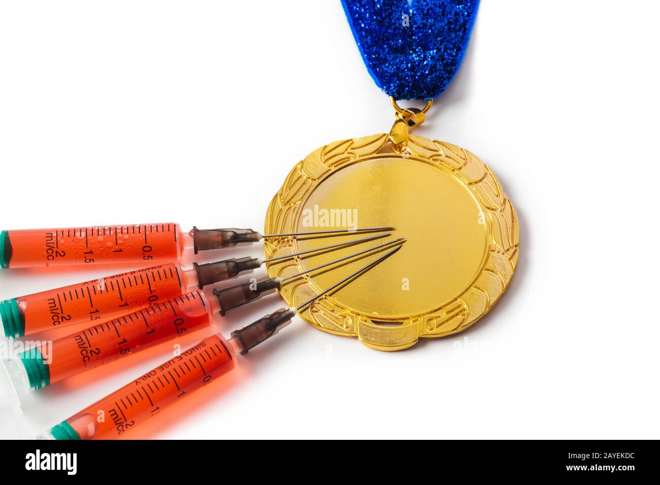 Gold medal and syringes Stock Photo - Alamy