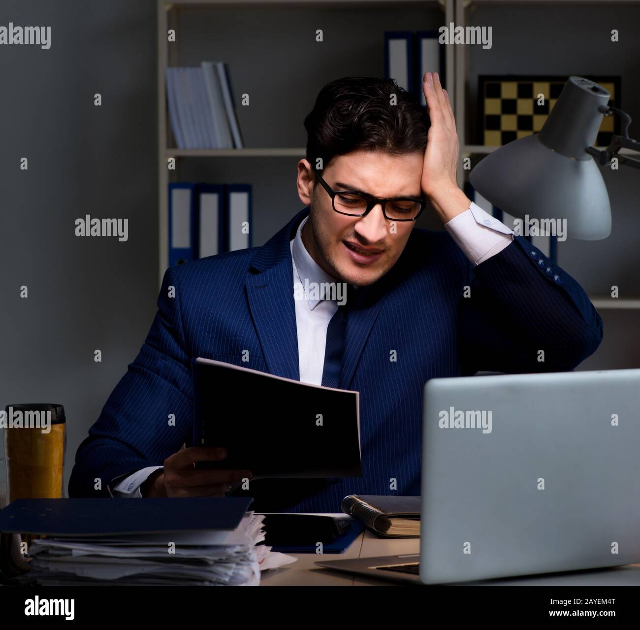 The employee working late to finish important deliverable task Stock ...