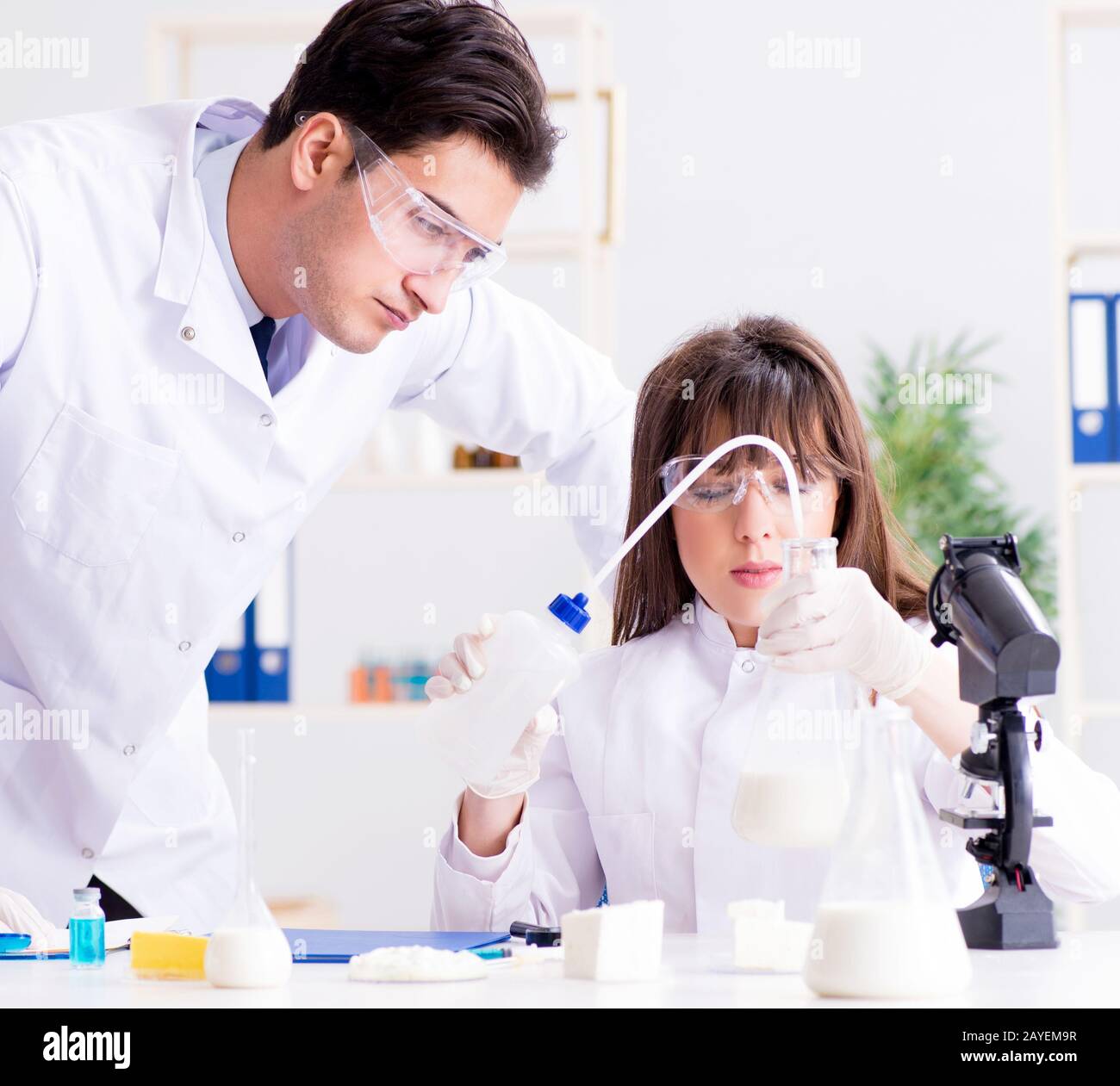 Two lab doctor testing food products Stock Photo - Alamy
