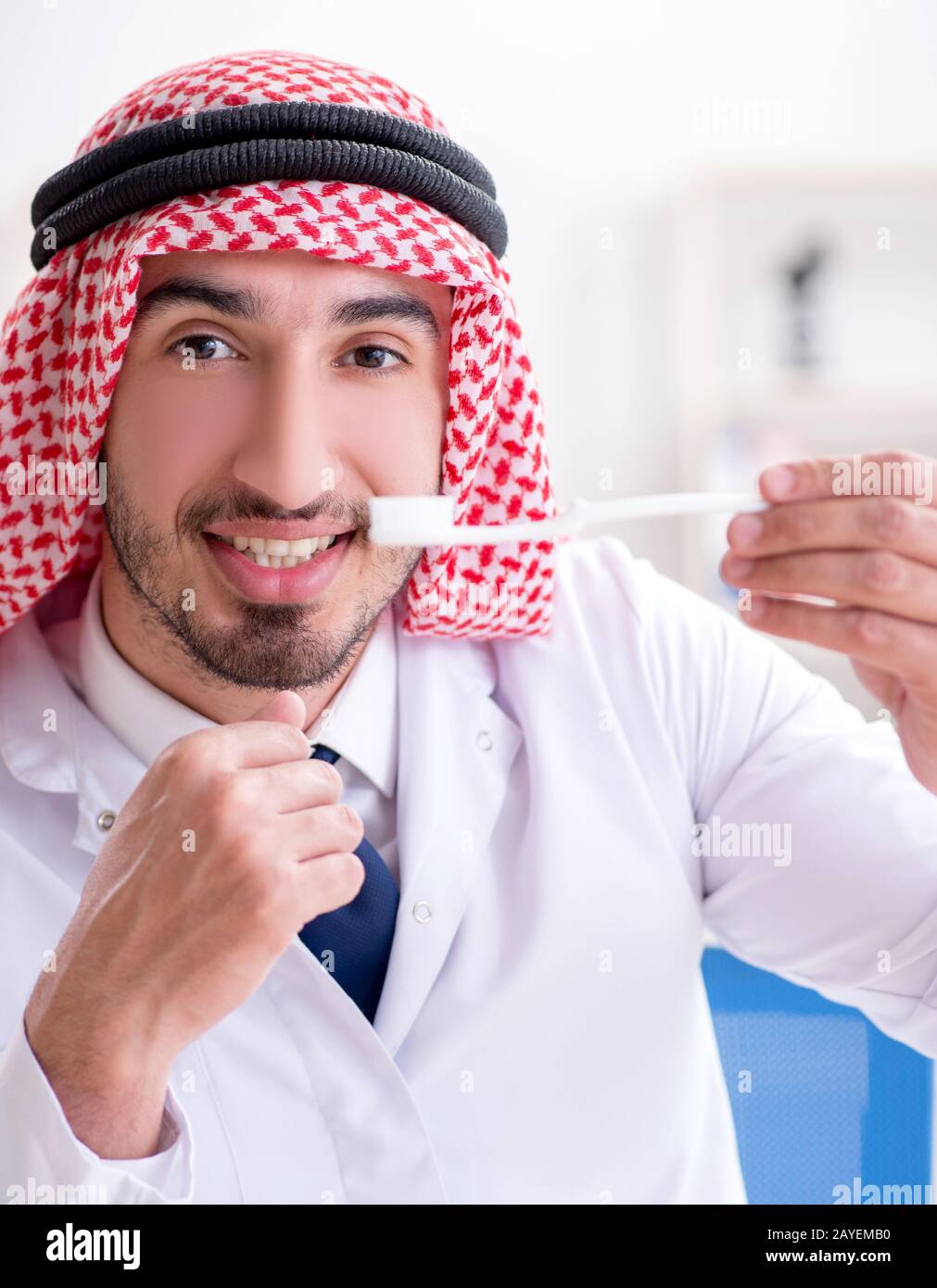 Arab dentist working on new teeth implant Stock Photo - Alamy