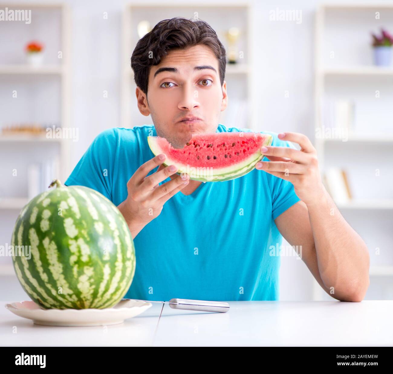 Handsome smiling boy eating tasty hi-res stock photography and images ...