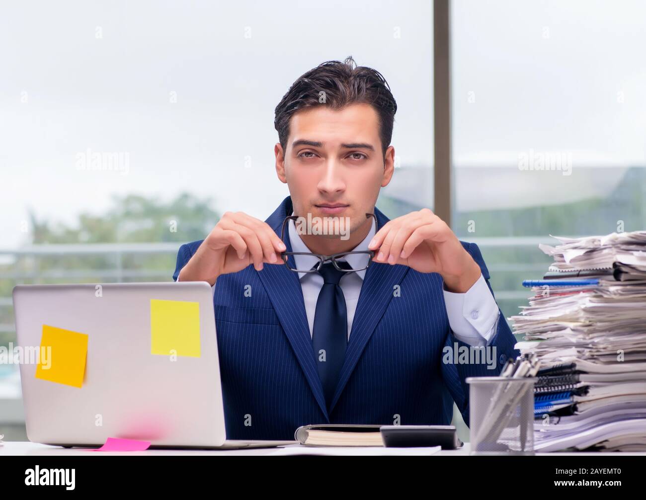 Workaholic businessman overworked with too much work in office Stock ...