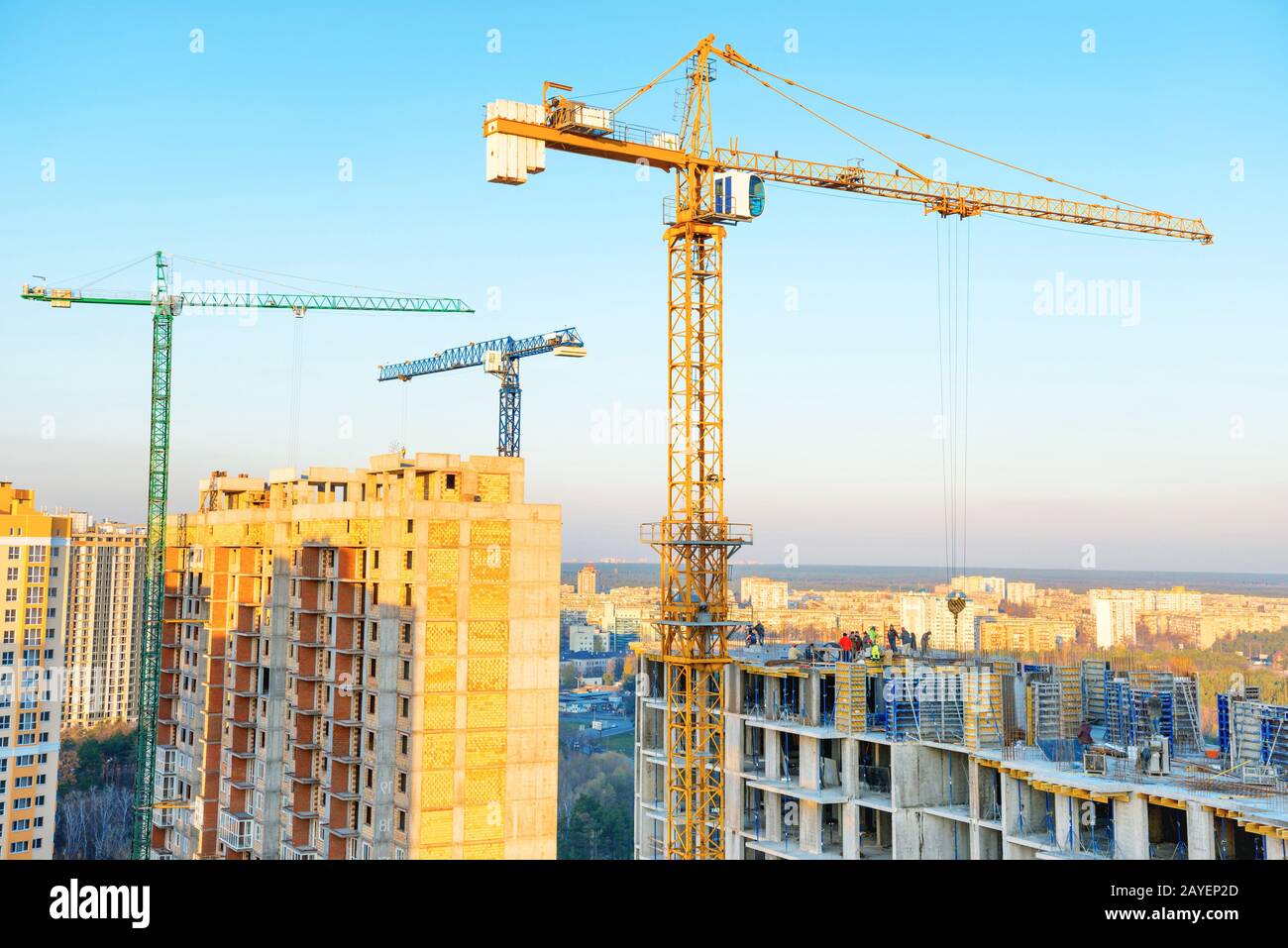 Cranes on industrial building site Stock Photo - Alamy