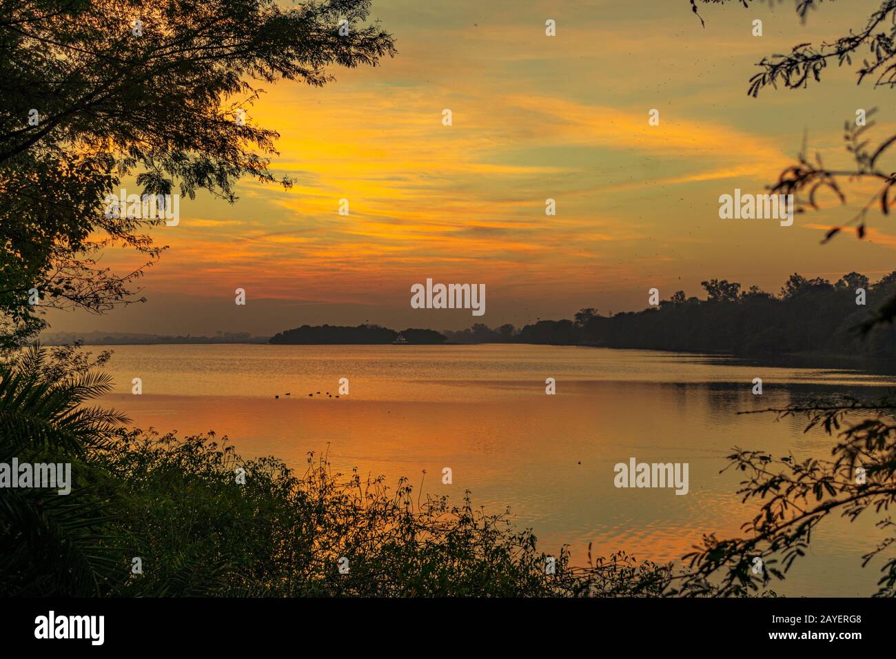 Sunset at Sirpur Lake Indore. Sirpur Lake was created by the Holkars of ...
