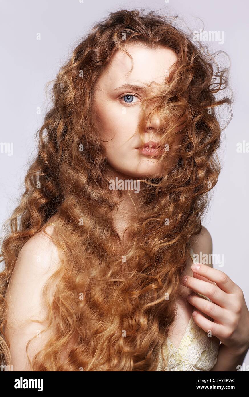 Portrait of a young caucasian woman with long golden wavy hair Stock ...