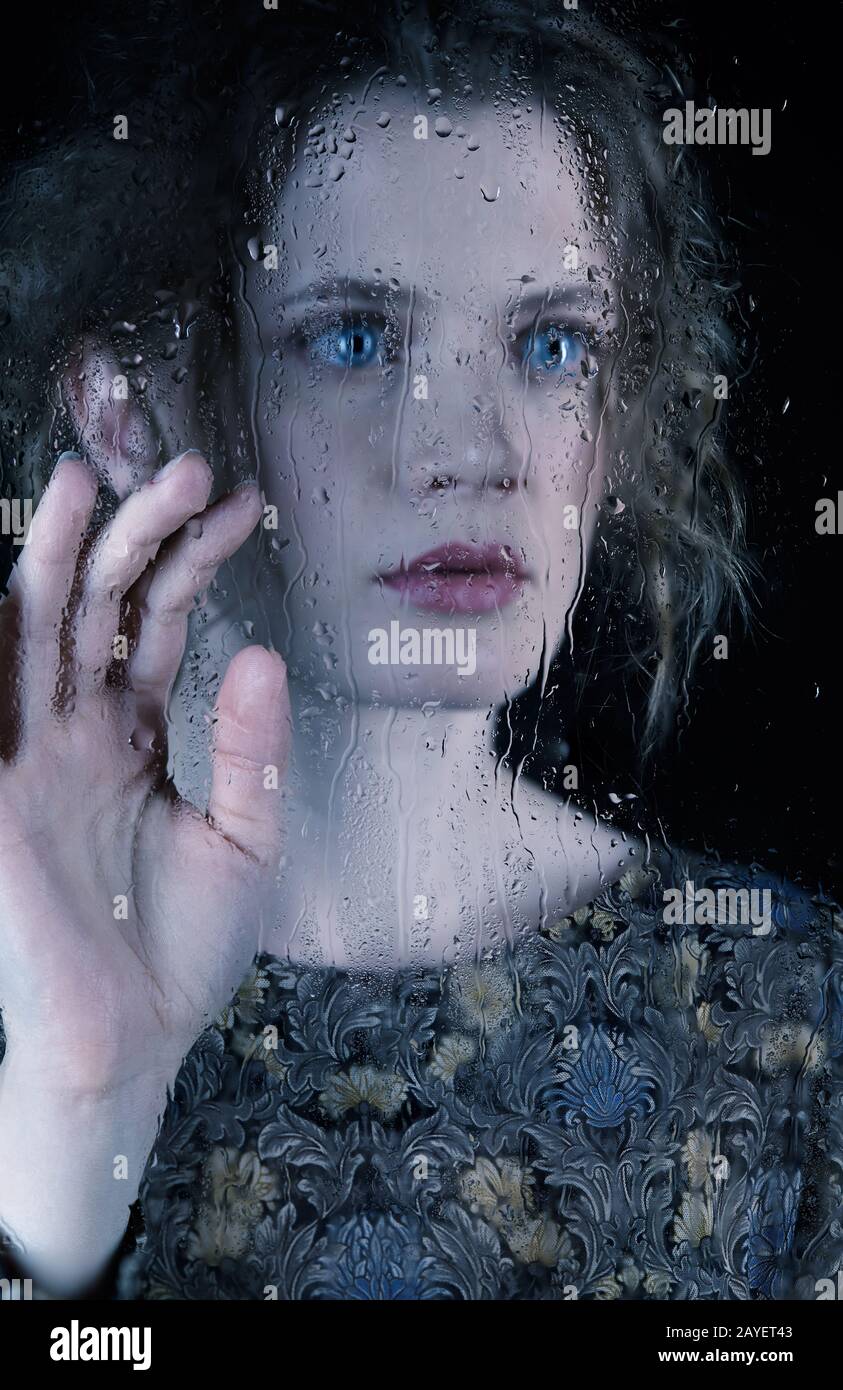 Old lady behind the window hi-res stock photography and images - Alamy