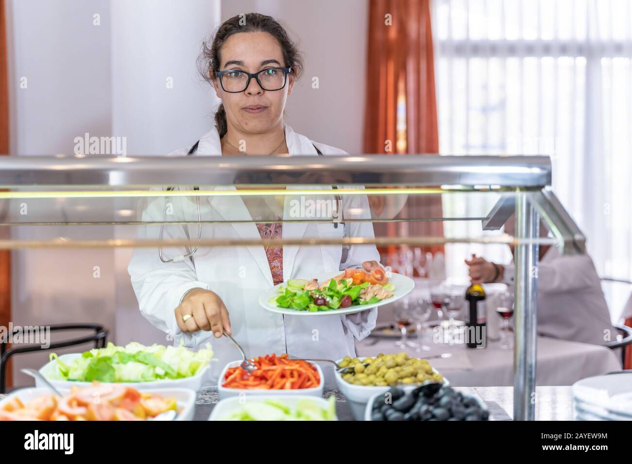 Stock photo of doctor taking food from a self service restaurant ...