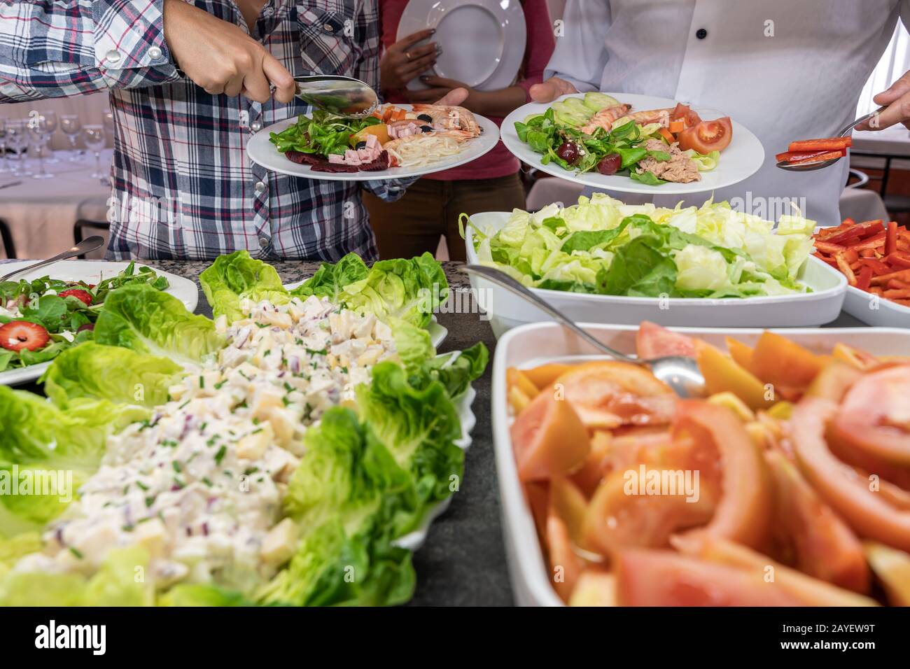 Stock photo of people taking food from a self-service restaurant full ...