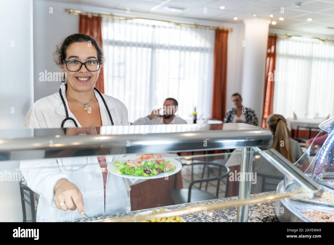 Stock photo of doctor taking food from a self-service restaurant with ...