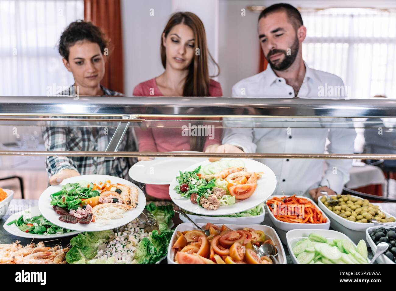 Stock photo of people with dishes in their hands waiting to be served ...