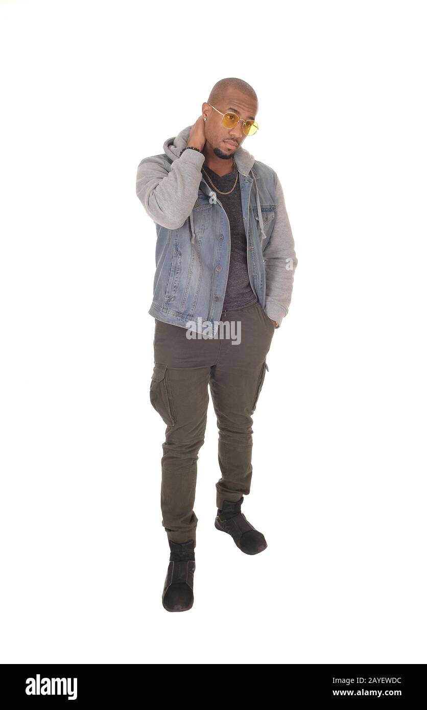 African man with his hand on his neck, thinking Stock Photo - Alamy