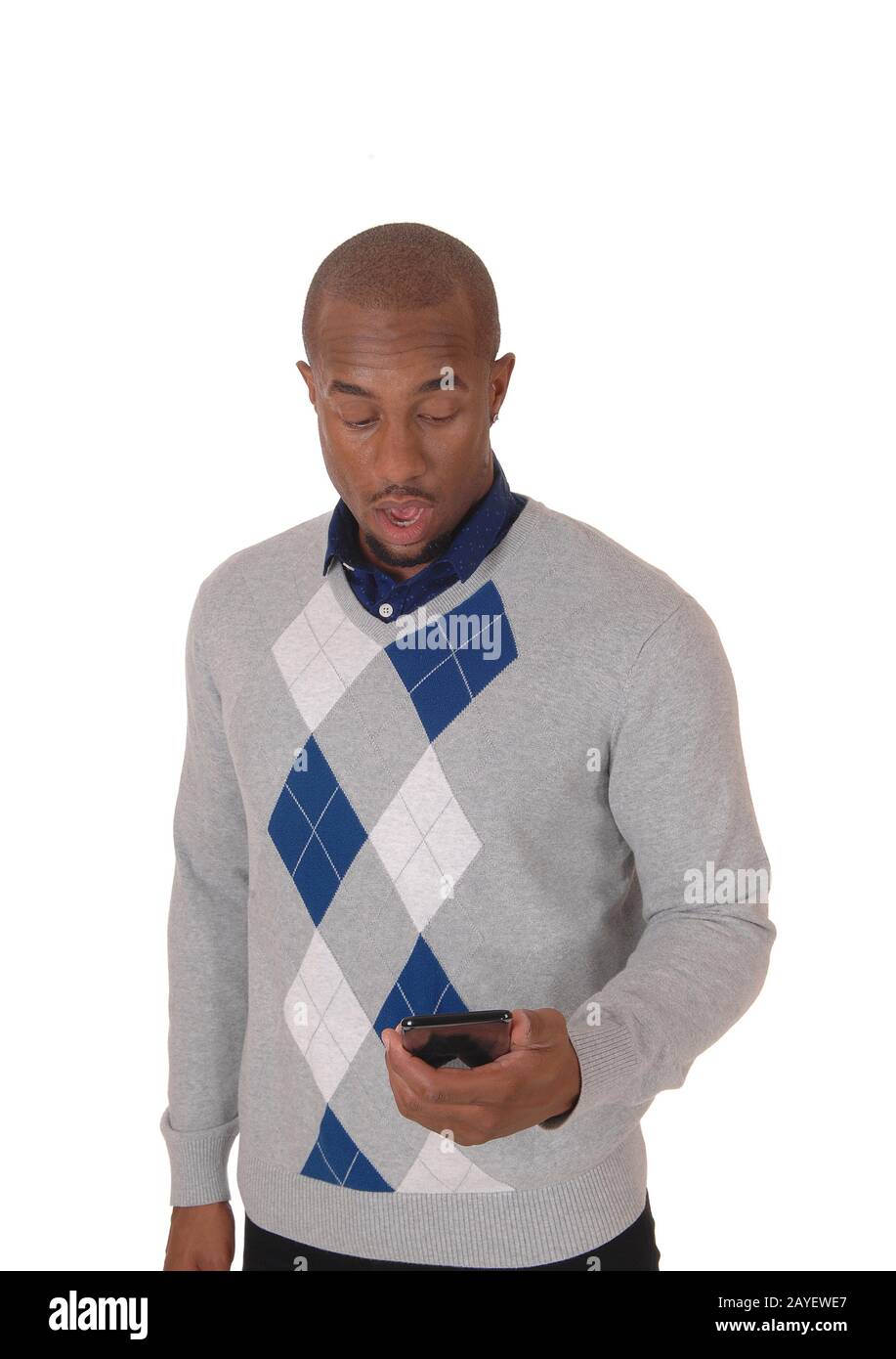 African man looking puzzled at his cellphone Stock Photo - Alamy