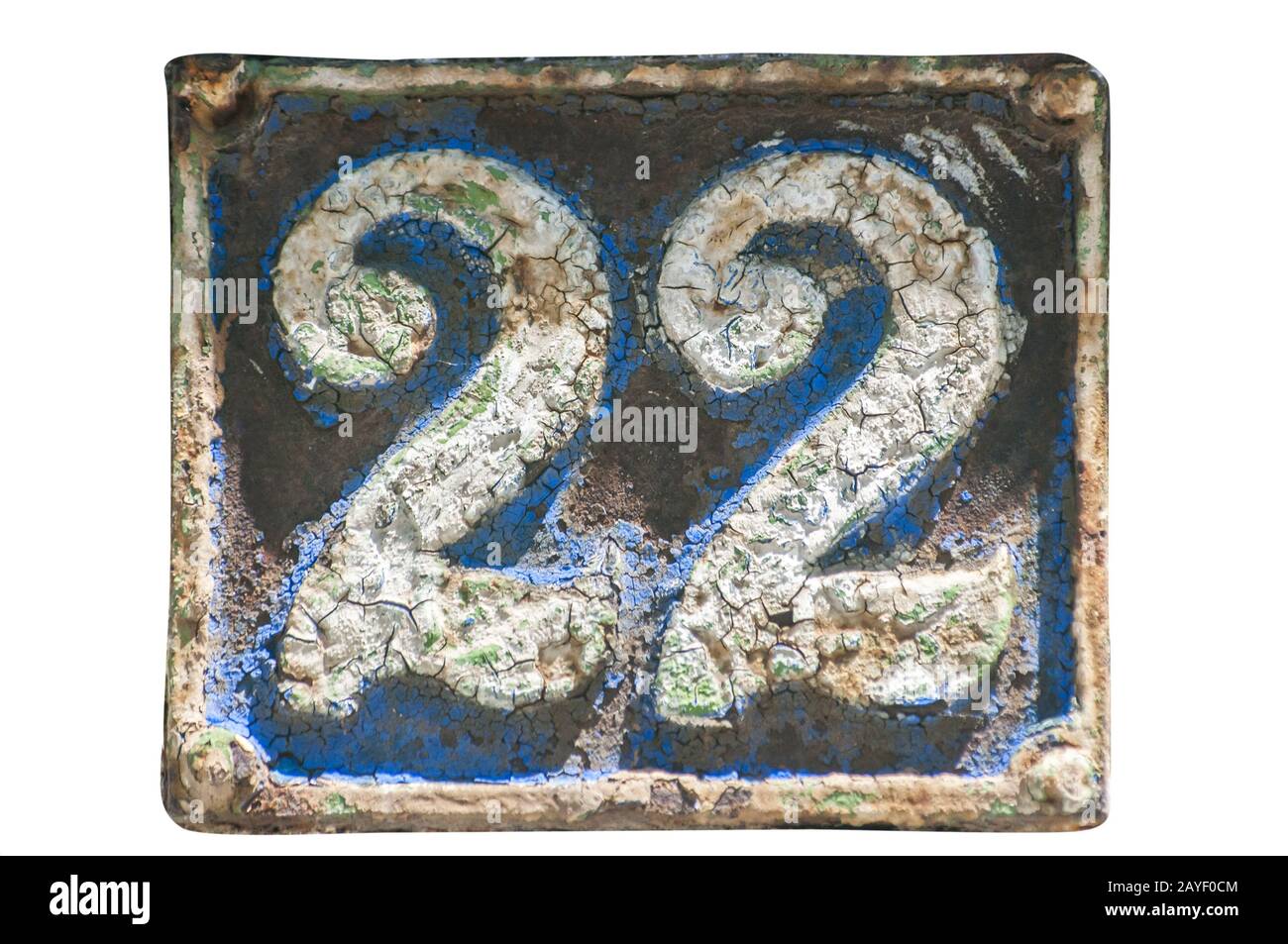 Old retro weathered cast iron plate with street number 22 closeup ...