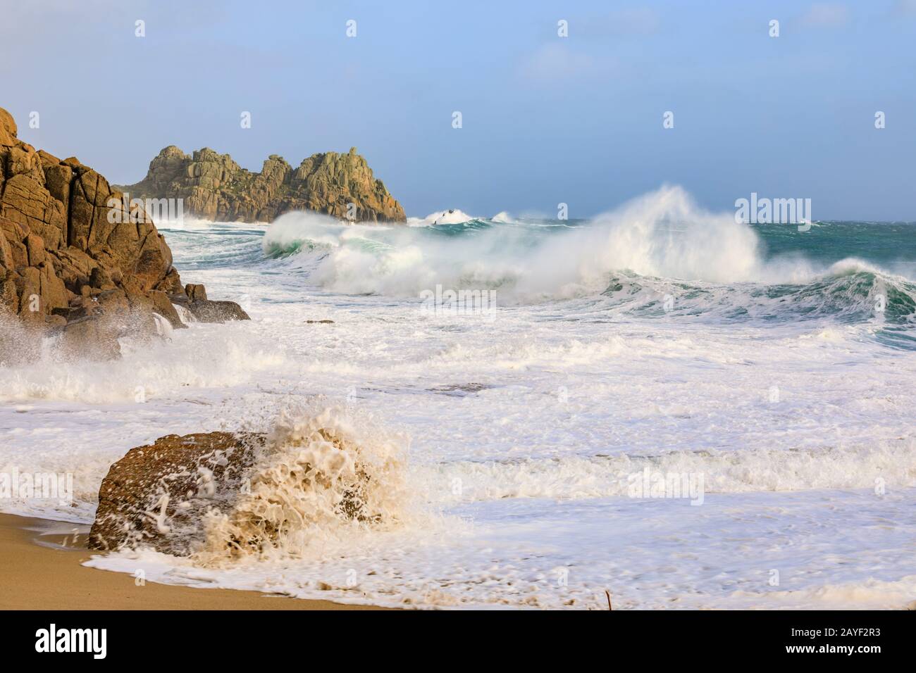 Logan Rock captured from Porthcurno Beach on a stormy afternoon in ...