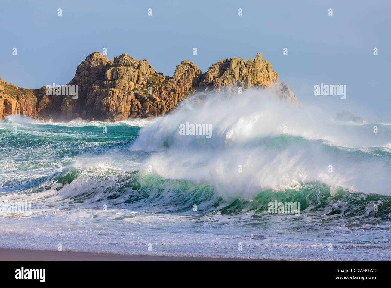 Logan Rock captured from Porthcurno Beach on a stormy afternoon in ...