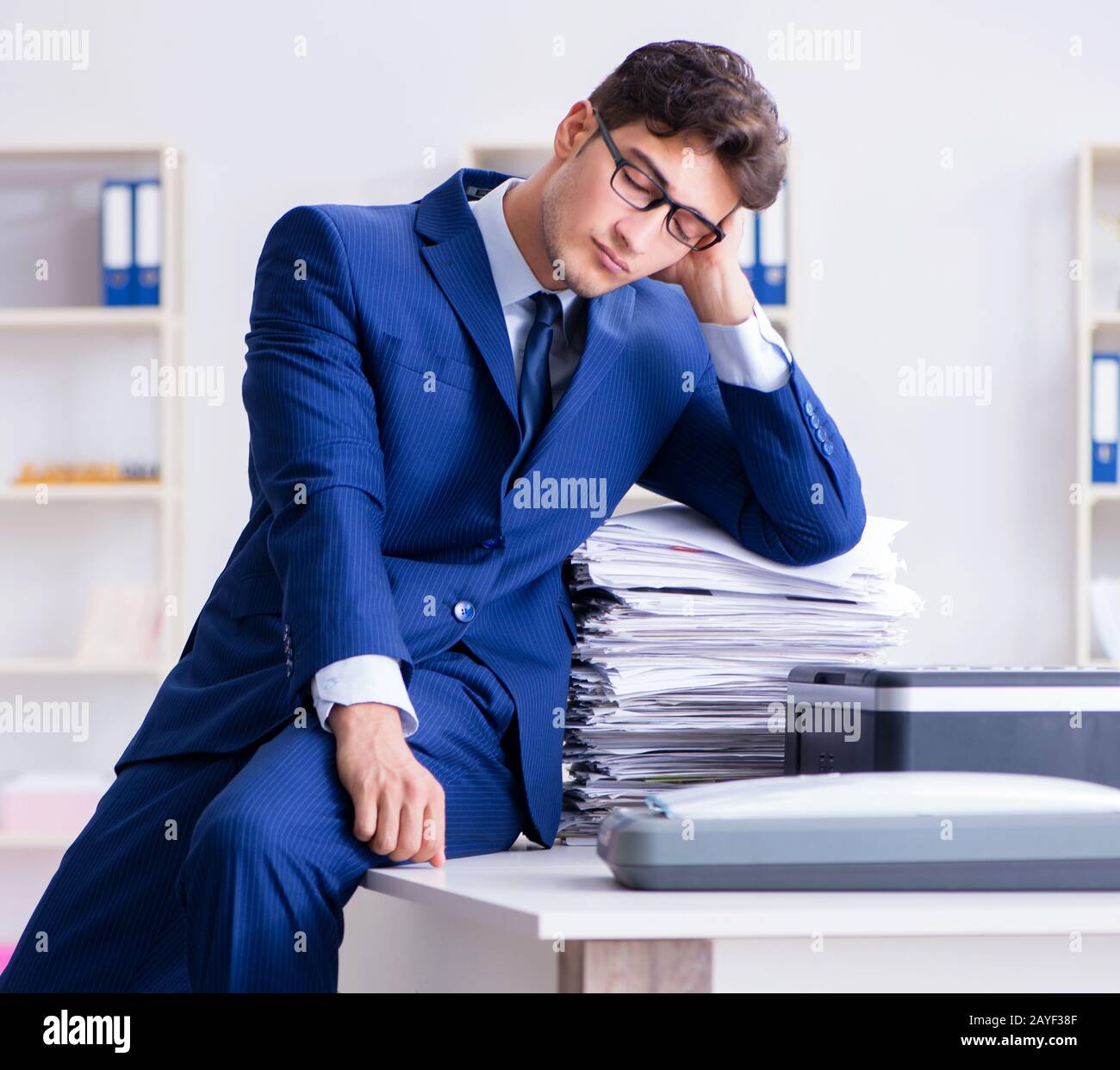 Businessman making copies in copying machine Stock Photo - Alamy