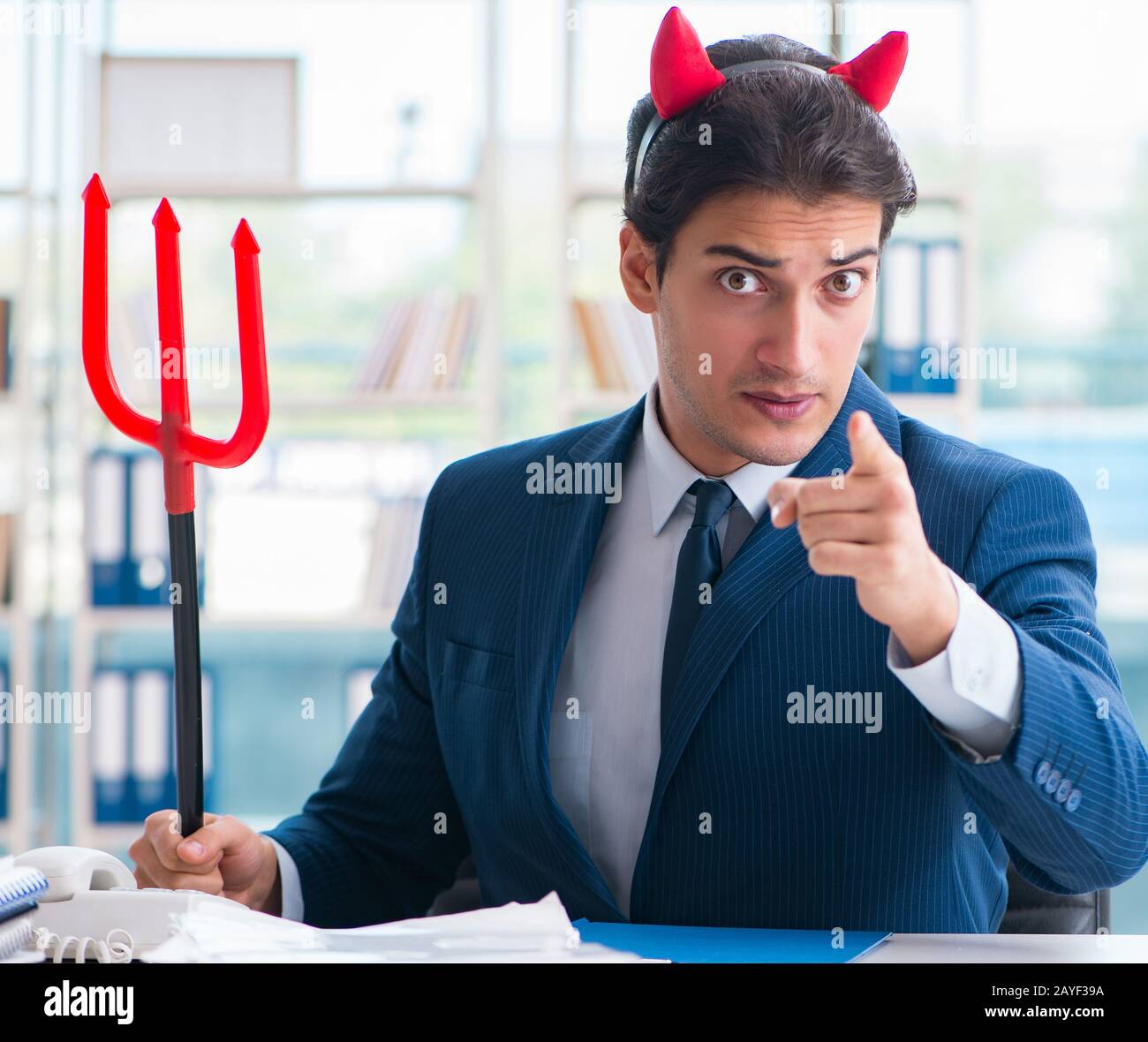 Devil angry businessman in the office Stock Photo - Alamy
