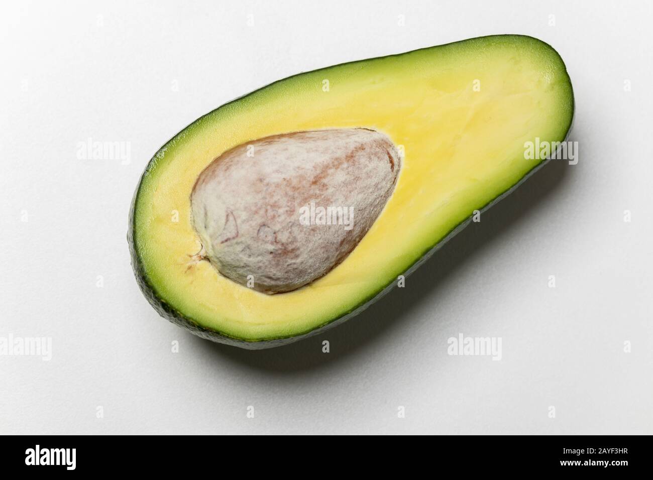 Avocado on white background Stock Photo - Alamy