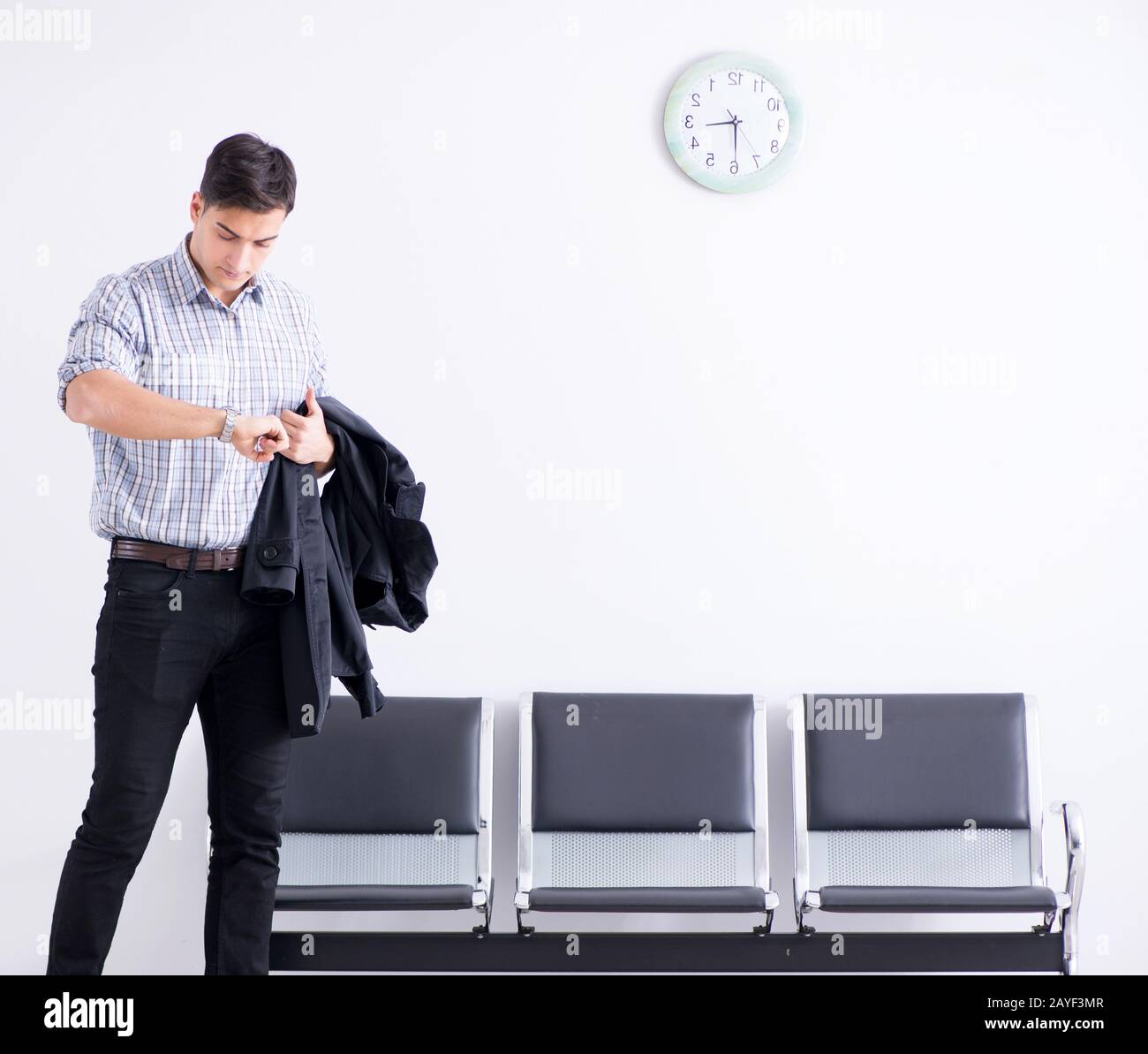 Man nervously impatiently waiting in the lobby Stock Photo - Alamy