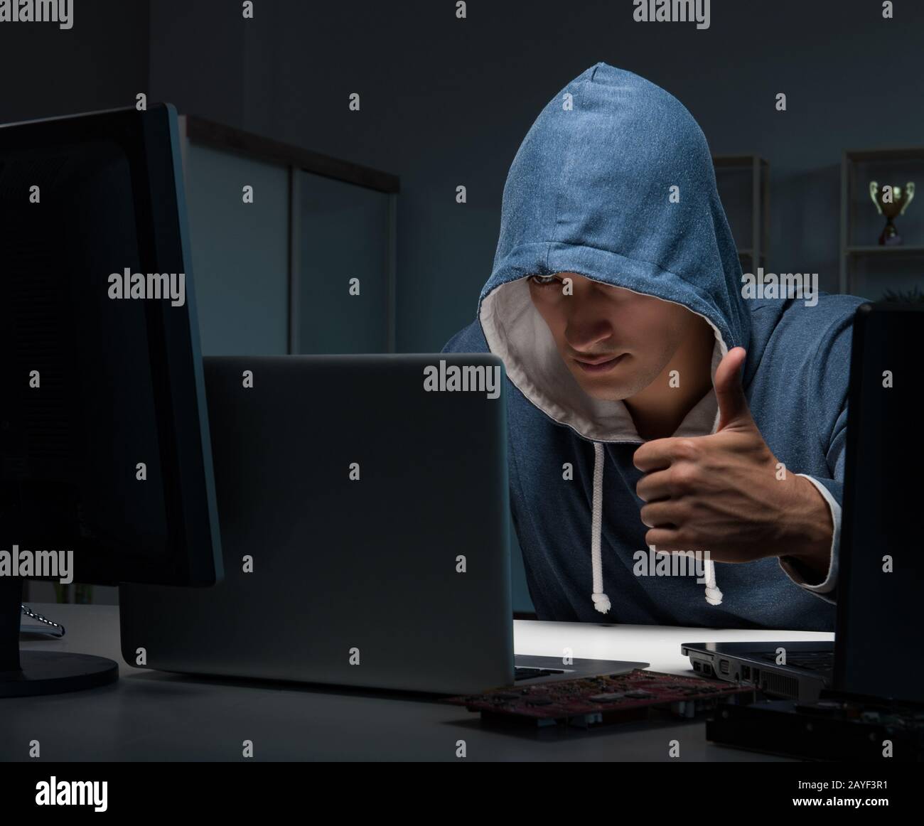 Hacker hacking computer at night Stock Photo - Alamy