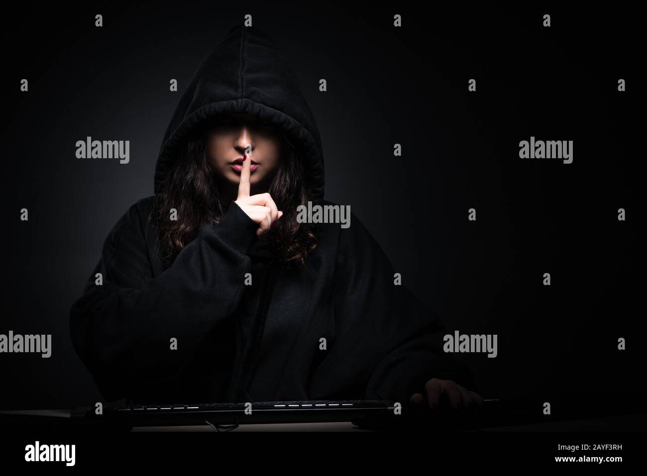 Female hacker hacking security firewall late in office Stock Photo - Alamy