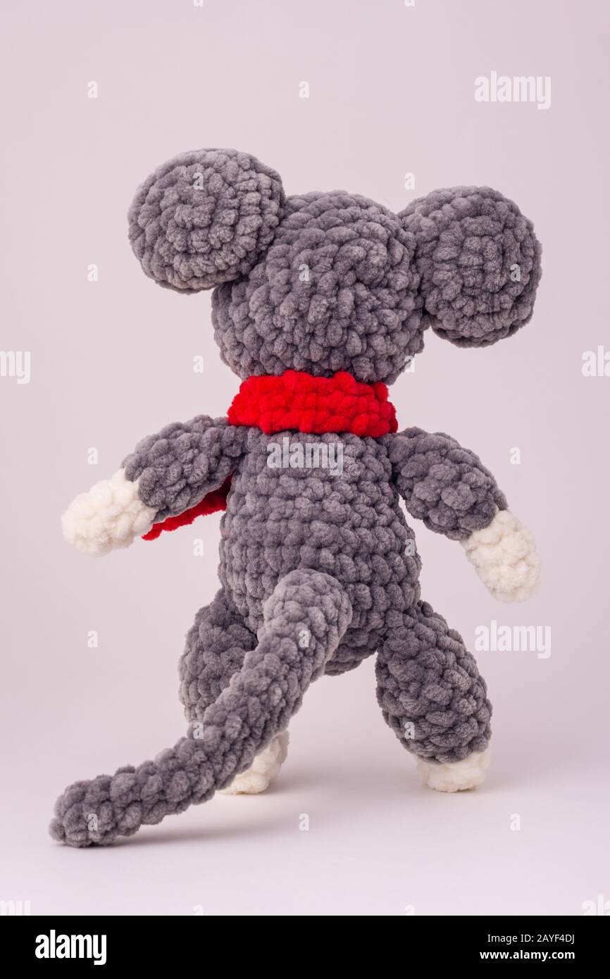 Funny knitted teddy mouse, Rear view, white background Stock Photo - Alamy
