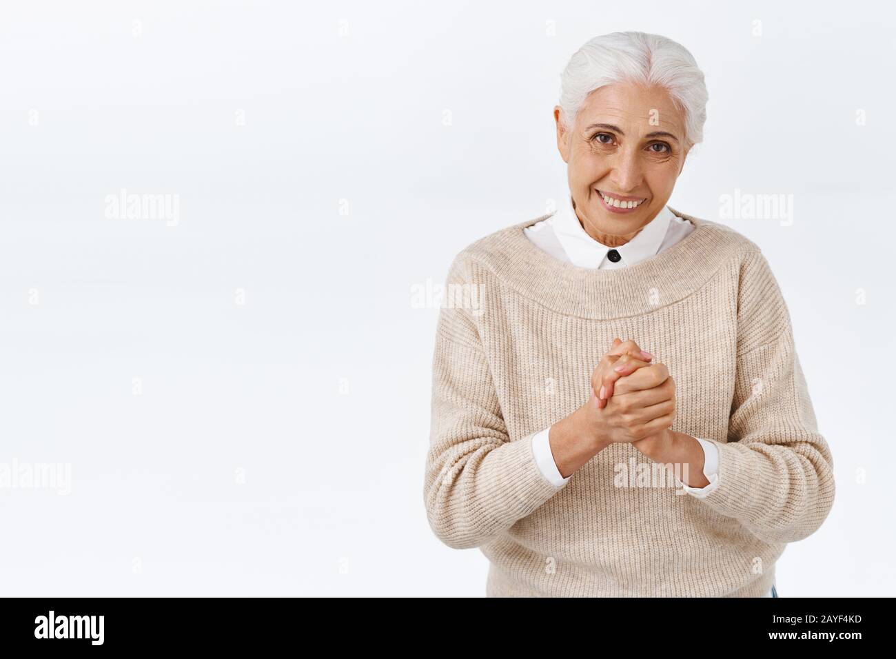 Senior lady office worker thanking dearly for coming, bowing politely ...