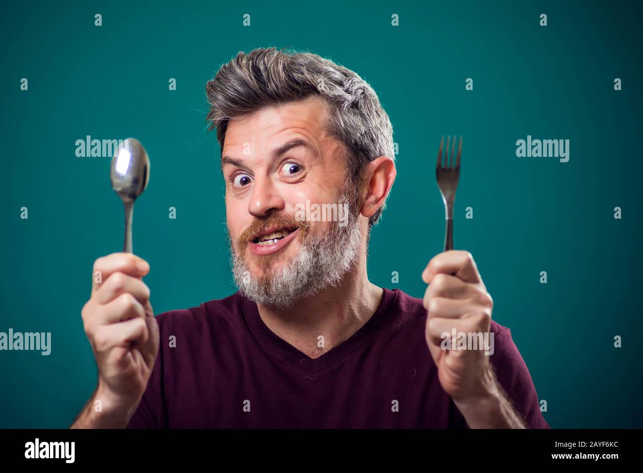 Man holding knife and fork hi-res stock photography and images - Alamy