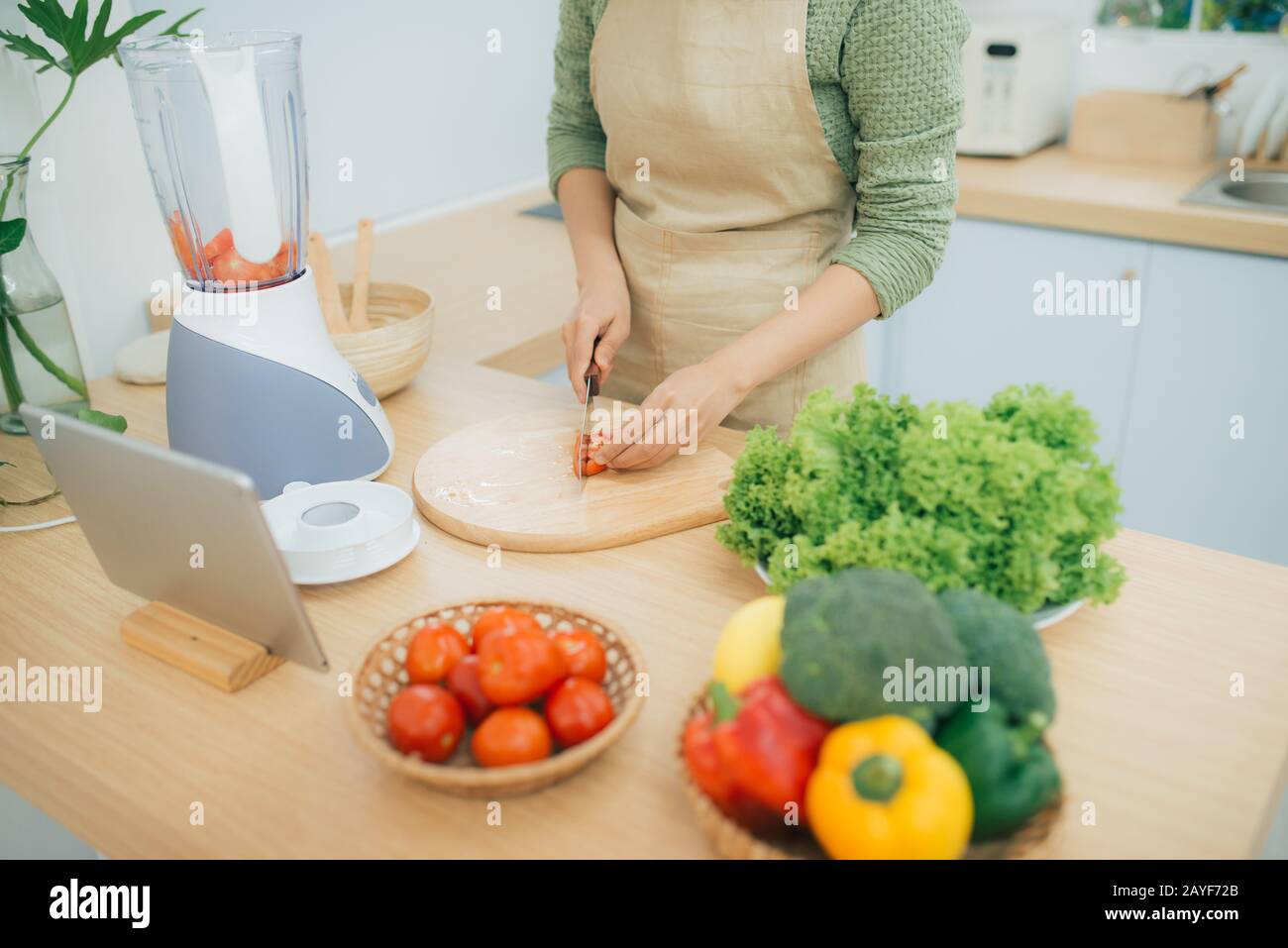 Beautiful lady cooking in kitchen hi-res stock photography and images ...