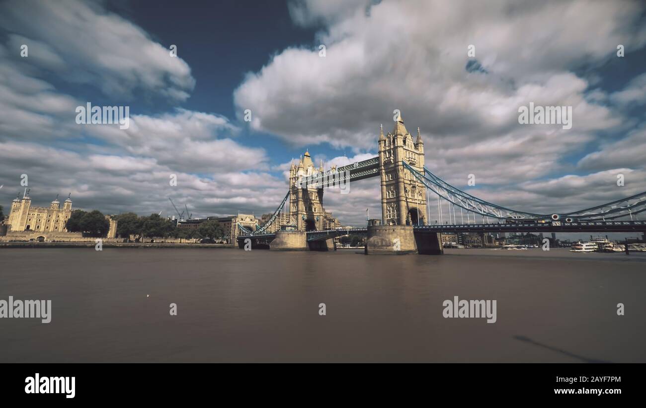 Tower Bridge over river Thames with sailing boats ships and London ...